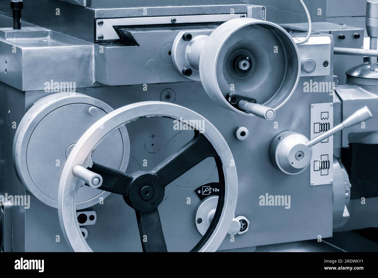 Lathe control knobs close up blue tone. Metal machine tools industry ...