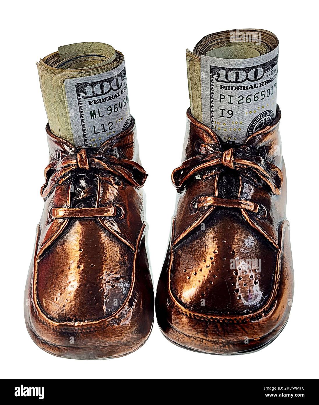 Bronzed baby shoes full of money to show saving for the future Stock ...
