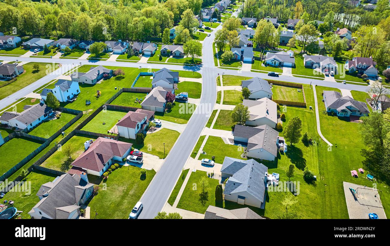 Houses in suburban neighborhood with wooden fences and clean roads ...