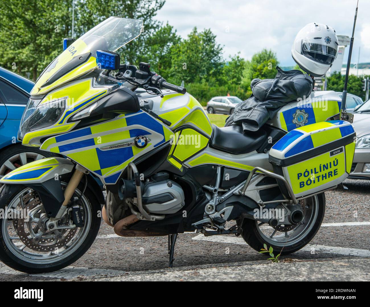View of police emblems in Ireland, emblem on building, car, and street ...