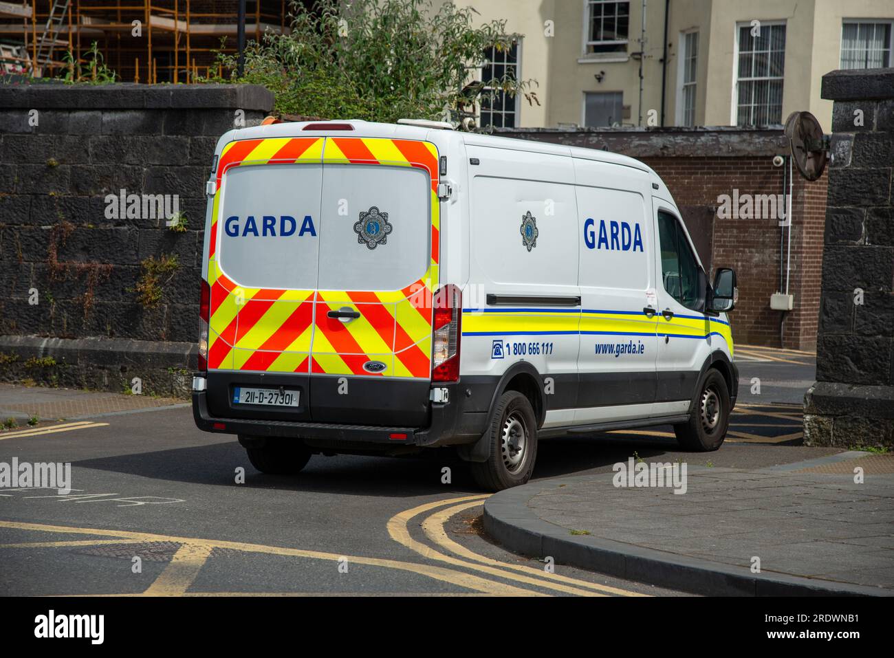 View of police emblems in Ireland, emblem on building, car, and street ...