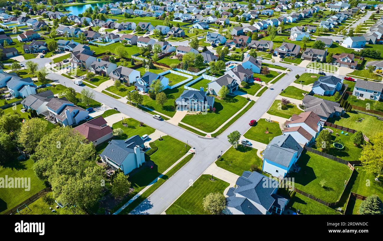 Various sized homes in large suburban neighborhood with trampoline in ...