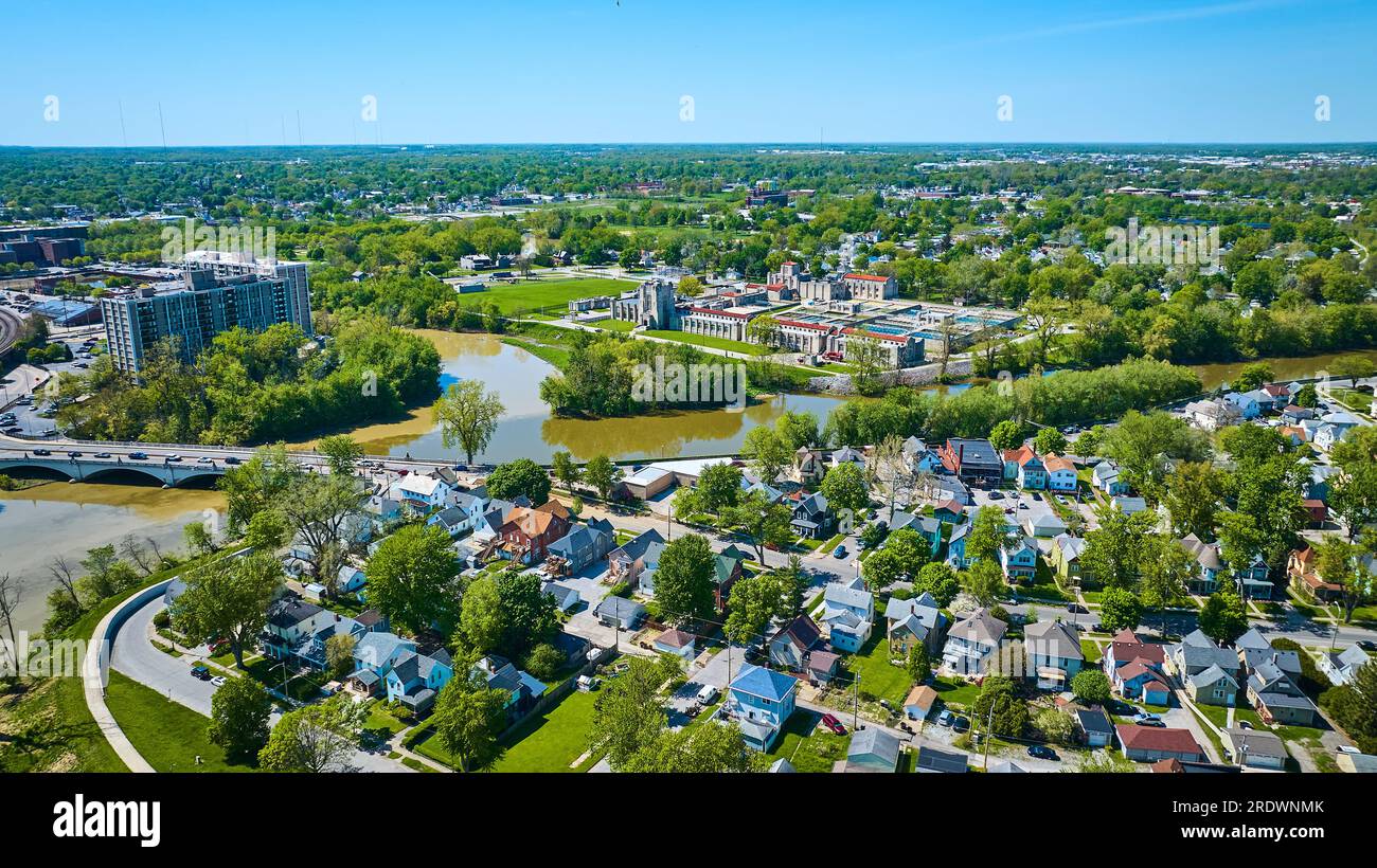 Downtown neighborhood with houses and water treatment plant across St ...