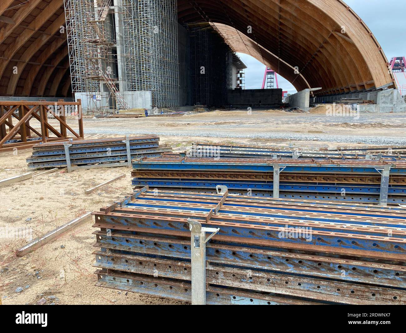 A lot of building materials with metal spare parts, sticks, beams ...