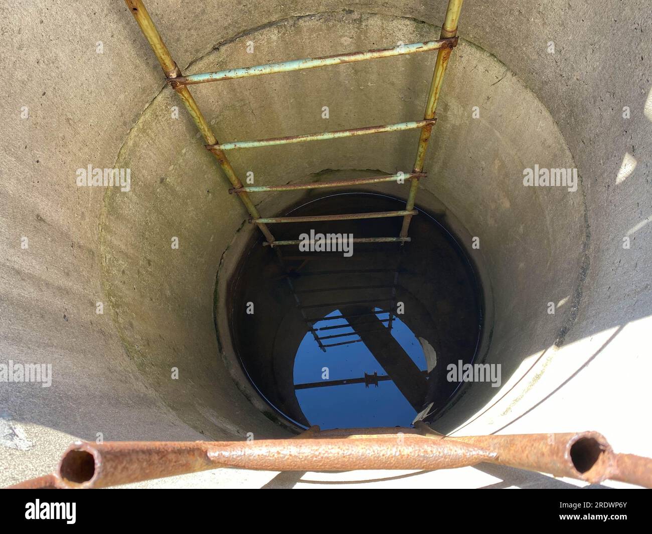 Homemade well. concrete rings are installed in the courtyard of the ...