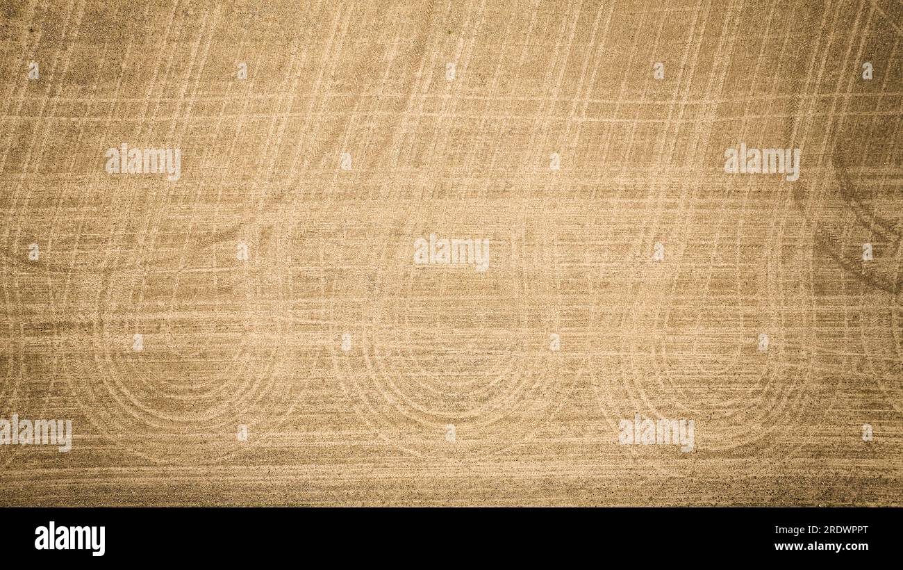 Empty dirt plowed tilled fields tractor lines visible in ruts in ground ...