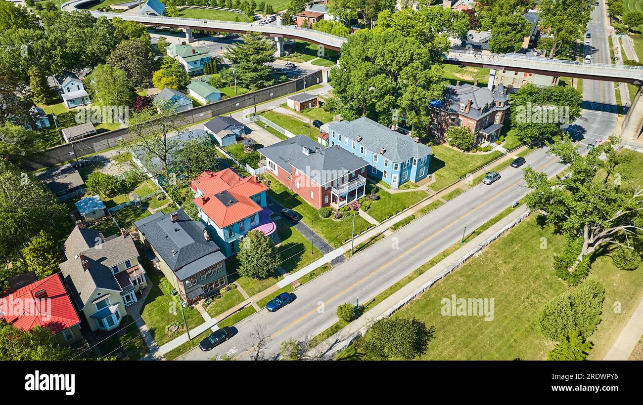 Aerial summertime suburban neighborhood in large city with suspended ...