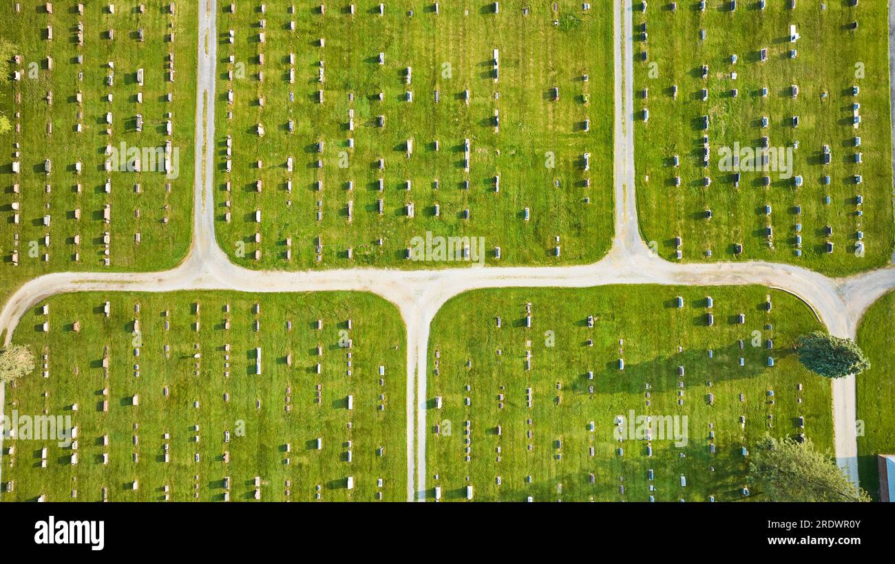 Aerial tombstones in graveyard with white gravel paths green grass one ...