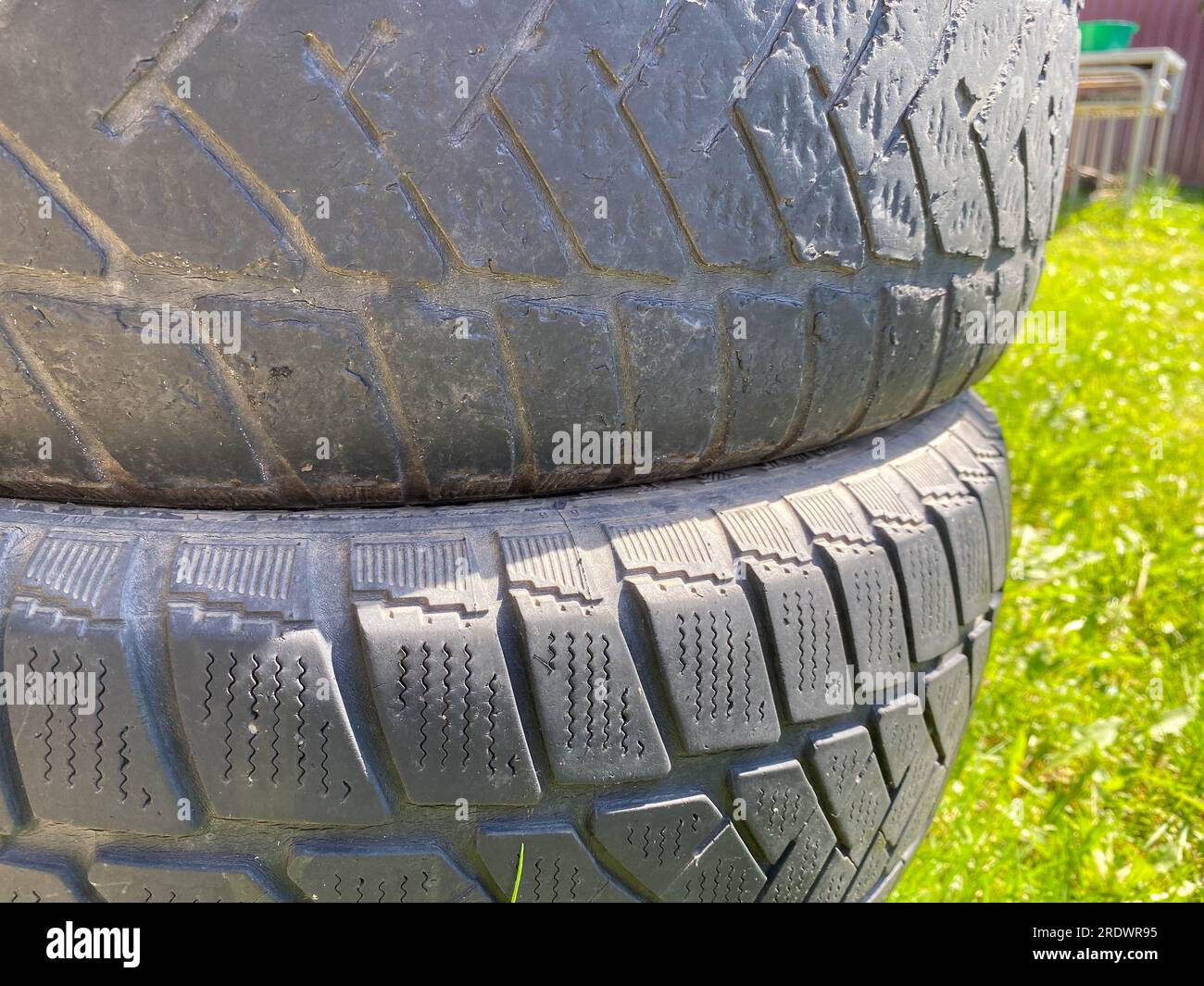 Bad black worn out bald tires on wheels and tires for a car with an end ...