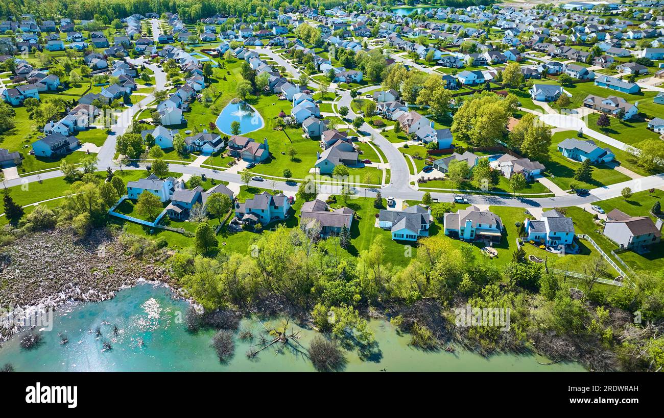 Large suburban neighborhood sharp shadows on hot summer day water ...