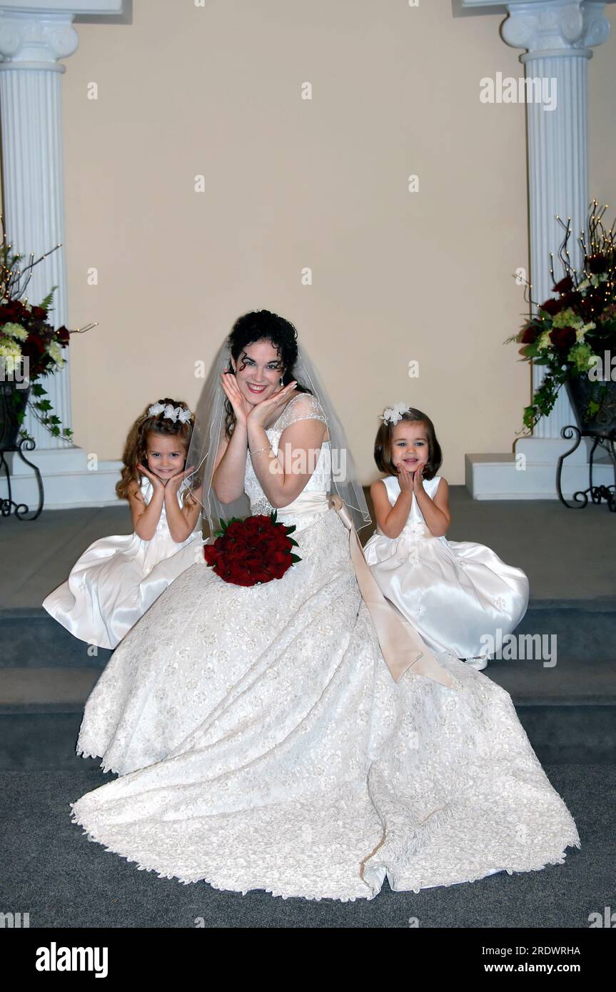 Bride and flower girls play a few games before the ceremony to create ...