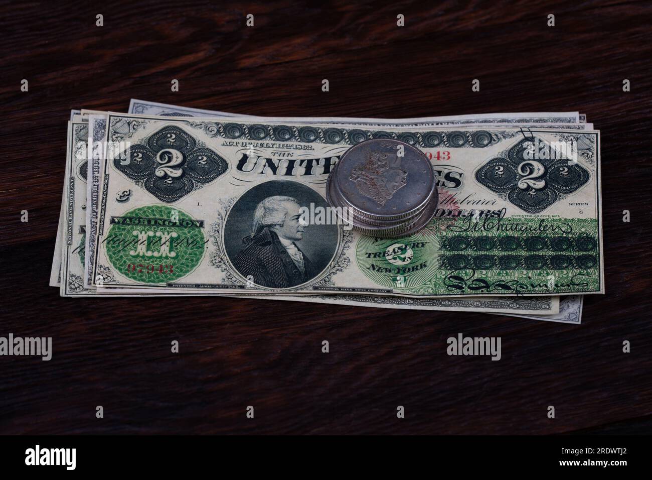 Old west US banknotes and silver certificates with silver dollar coins ...