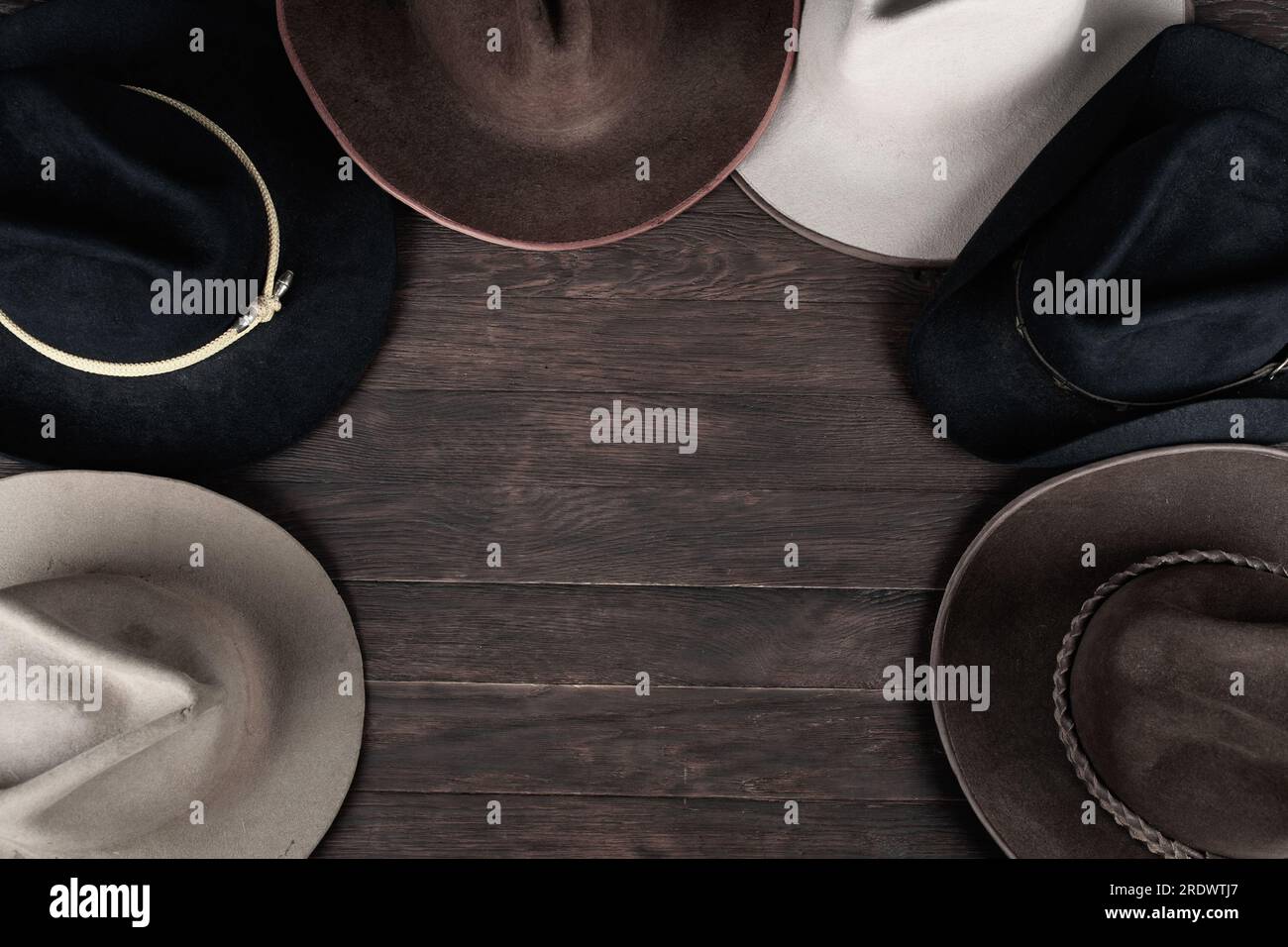 Old west hats on wooden table. Top view Stock Photo - Alamy