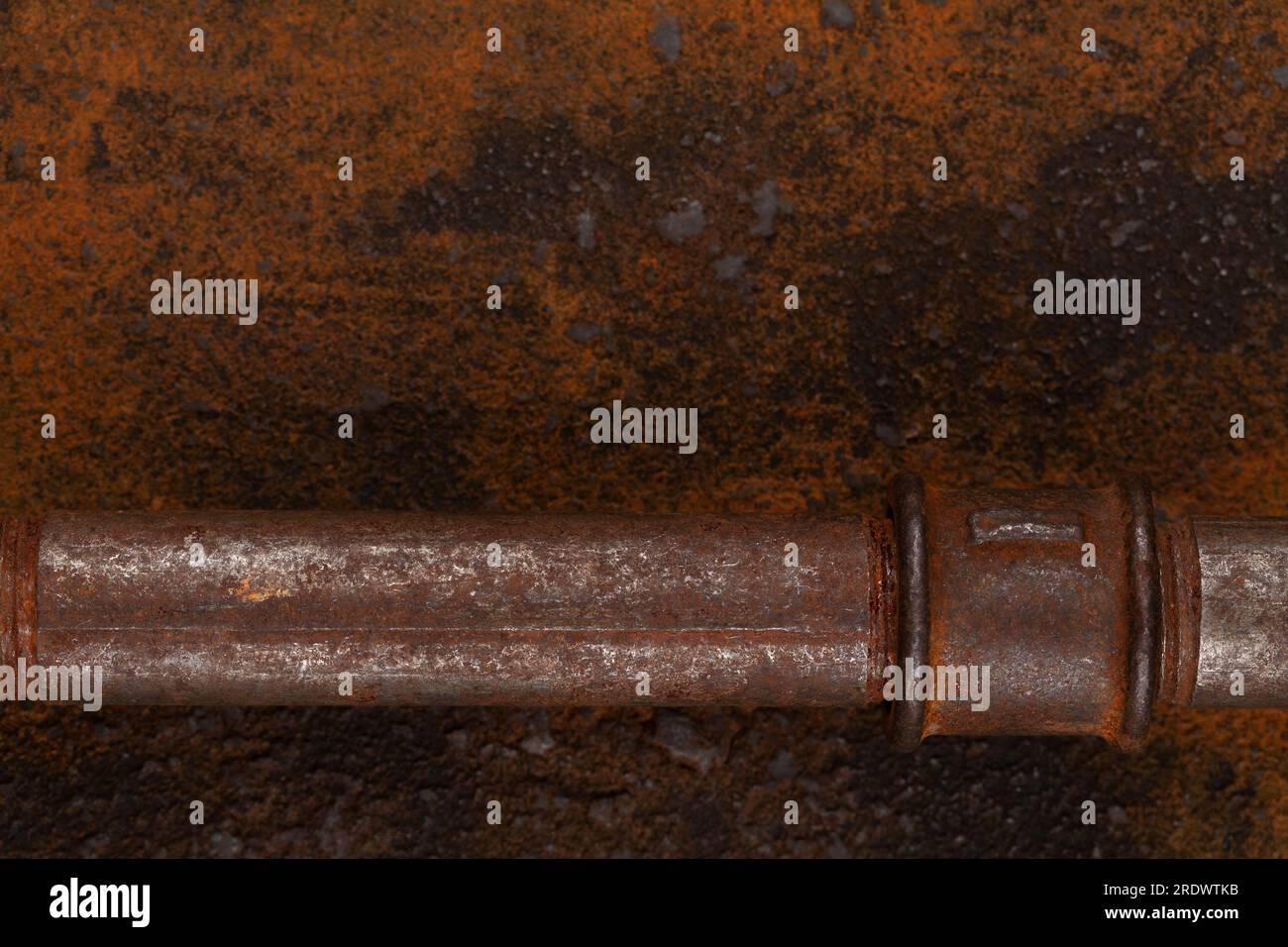 Rusty valve pipes on rusty metal wall background Stock Photo - Alamy