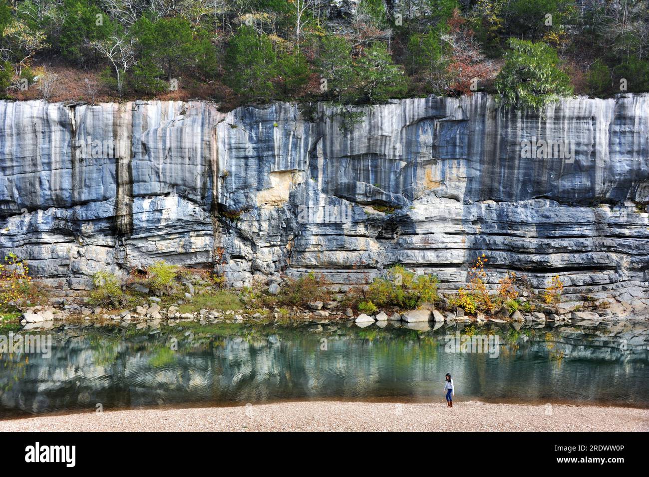 Tall cliffs of the Buffalo National River is streaked with grey, black ...