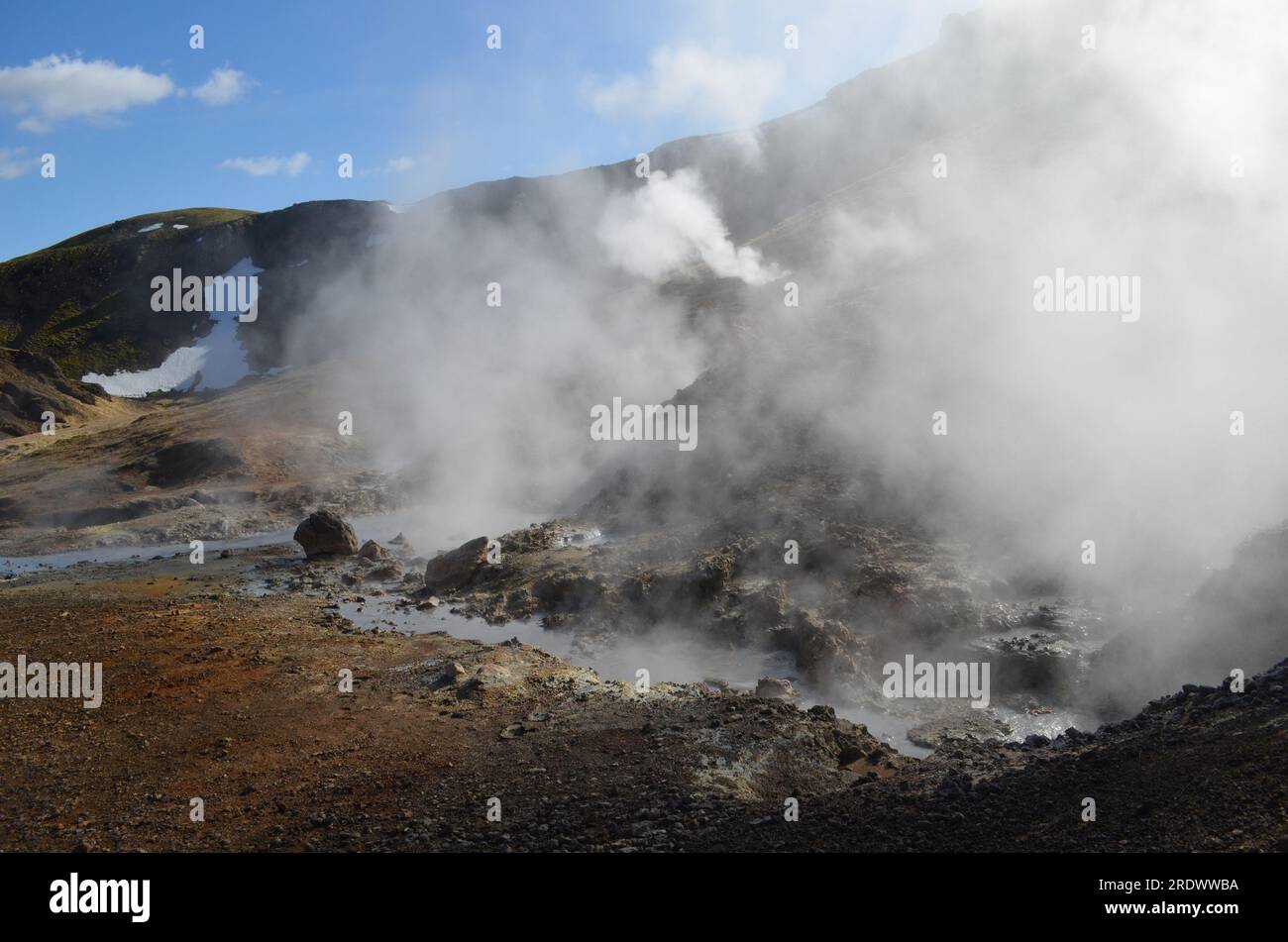 Icelands geothermal hot steam vapors rising up from volcanic landscape ...