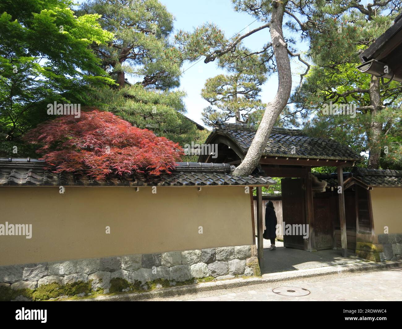 Nagamachi Samurai District, Kanazawa: a woman at the entrance gateway ...