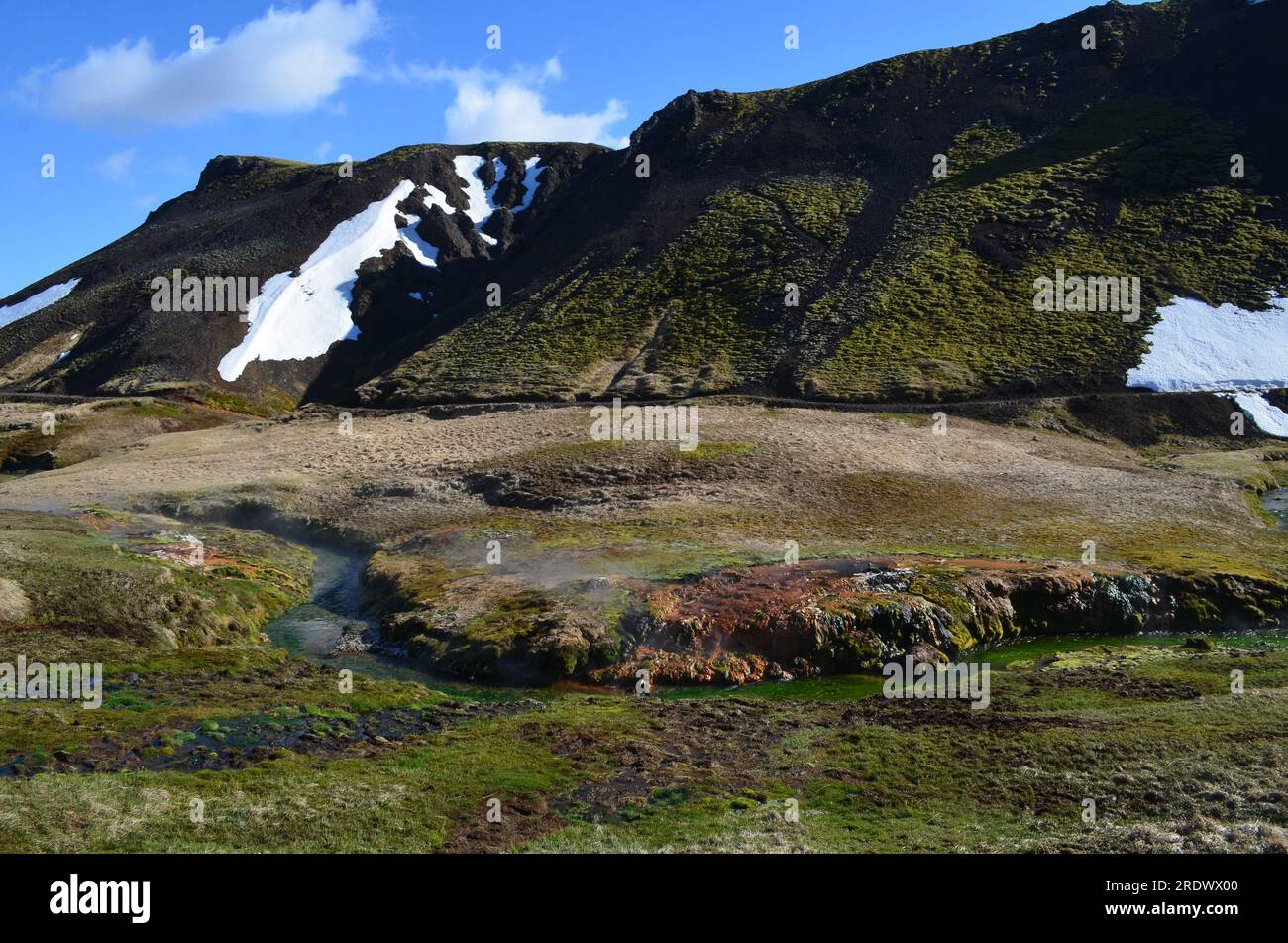 Steaming flowing hot spring in the volcanic landscape of Hveragerdi ...