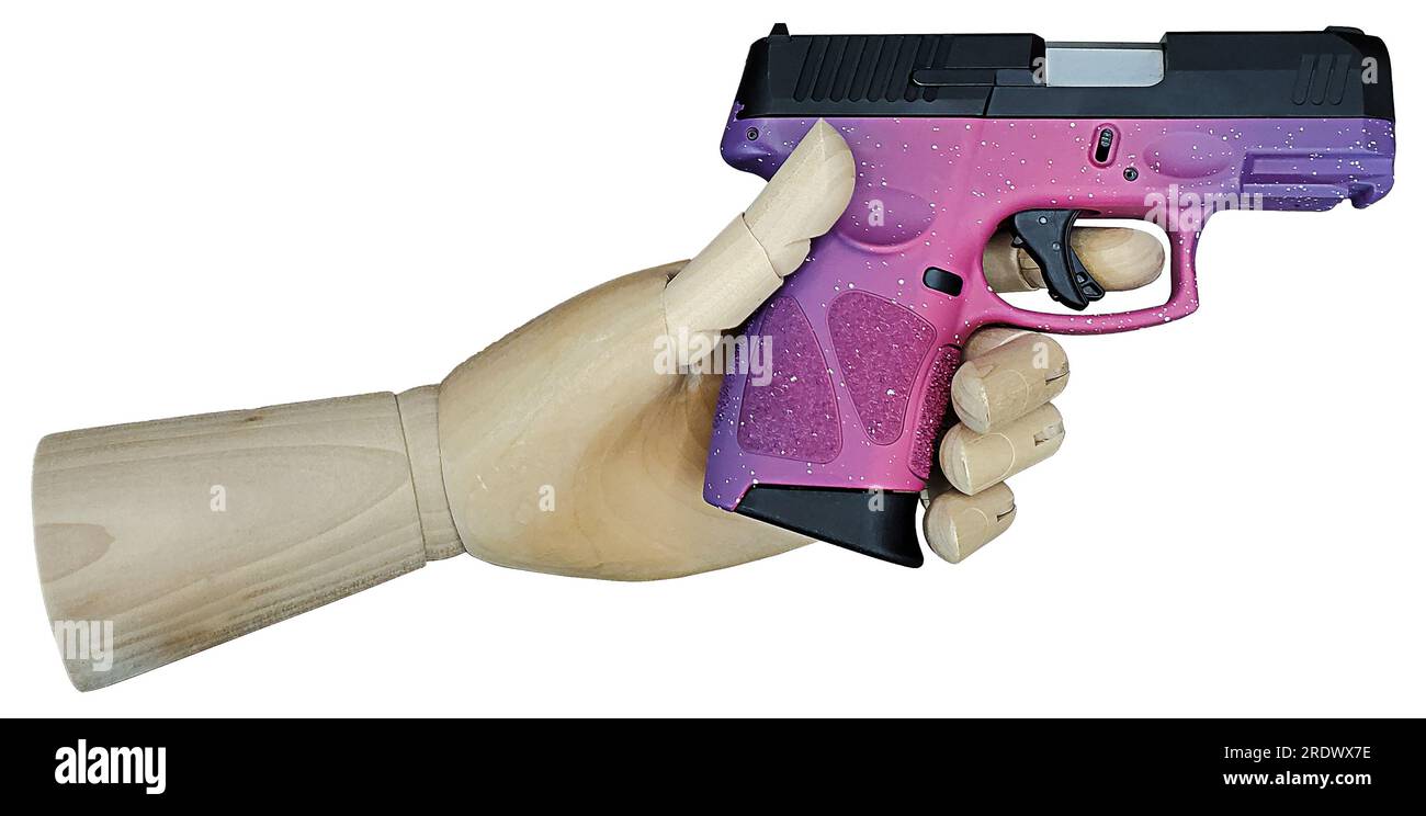 Wooden Hand holding a Purple metal gun with textured grip Stock Photo ...