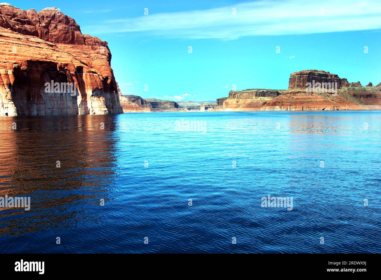 Red sandstone walls seem to go on forever as the Colorado River ...