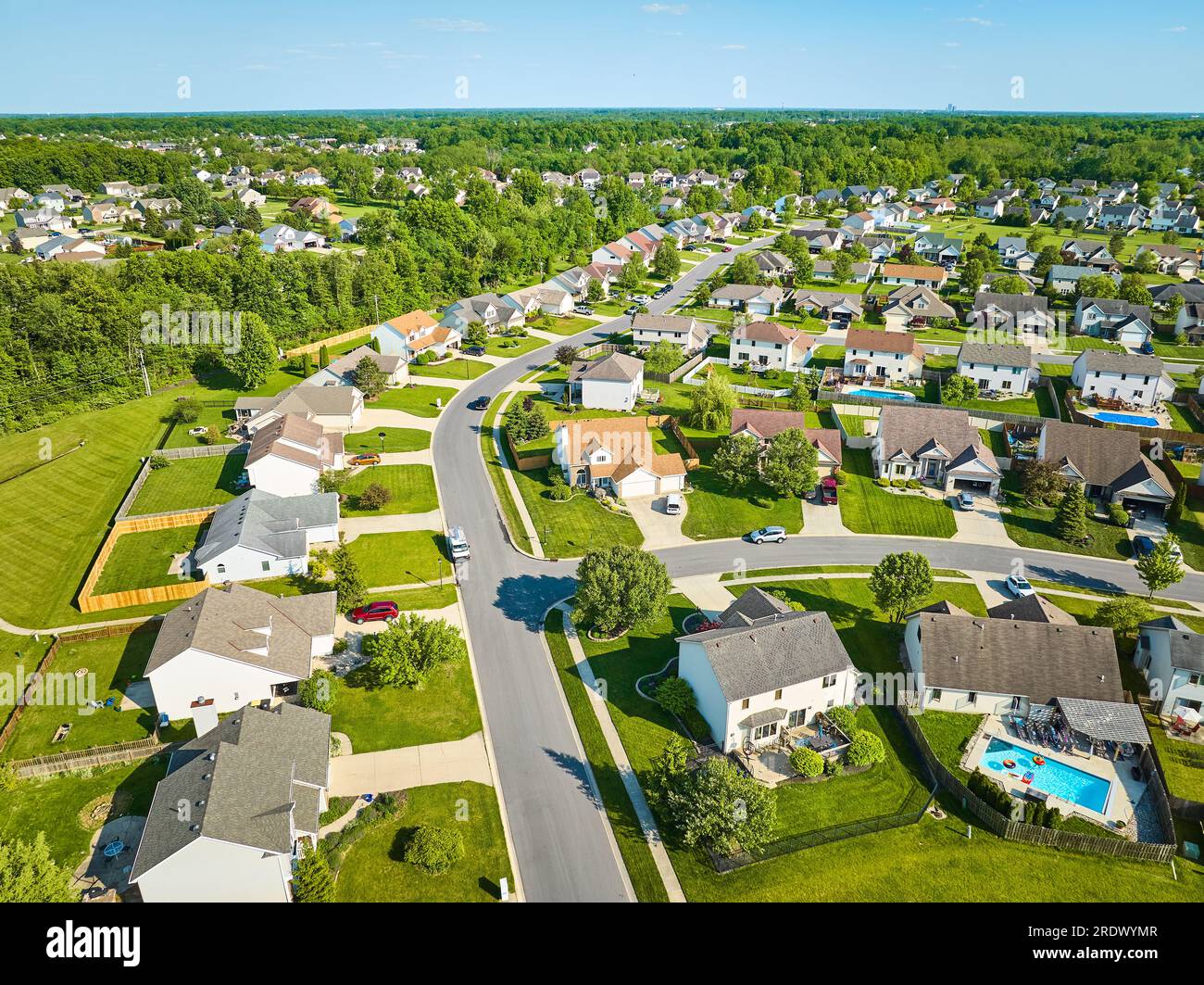 Aerial neighborhood with pools in yards and cars in driveways Stock ...