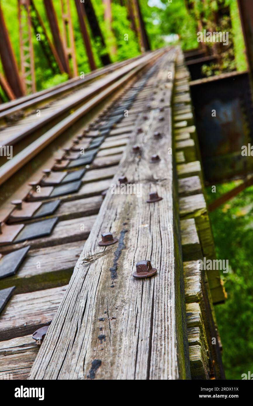 Blurred background of railroad bridge with nuts and bolts on textured ...