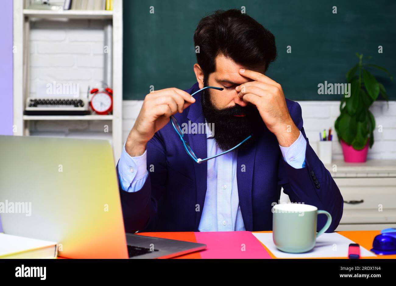 Online test. Tired student thinking about coursework. Overworked ...