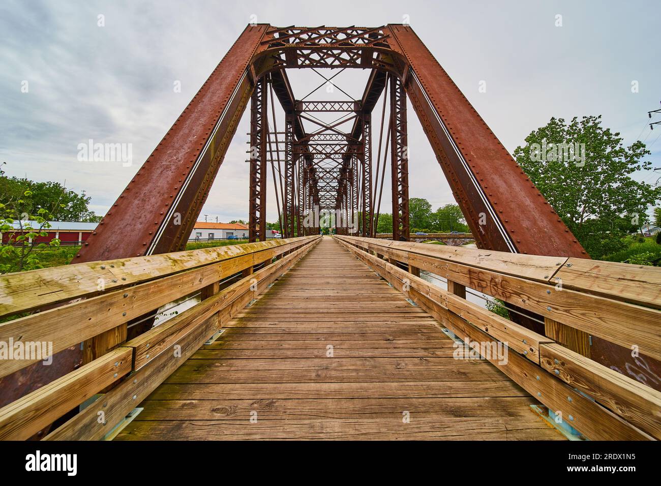 Wooden walking bridge inside converted old railway train bridge in ...
