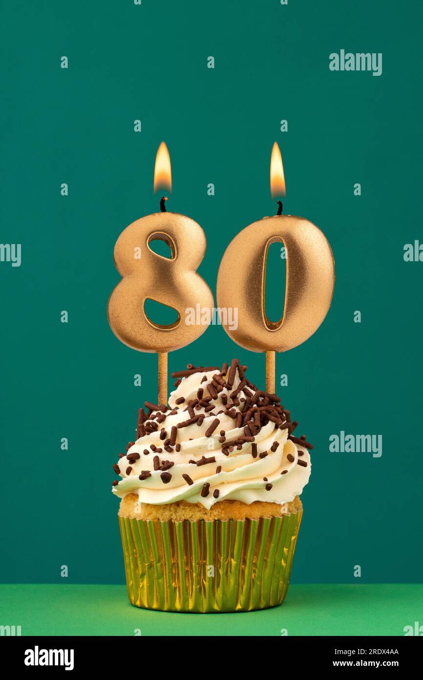 Birthday card with candle number 80 - Green background Stock Photo - Alamy