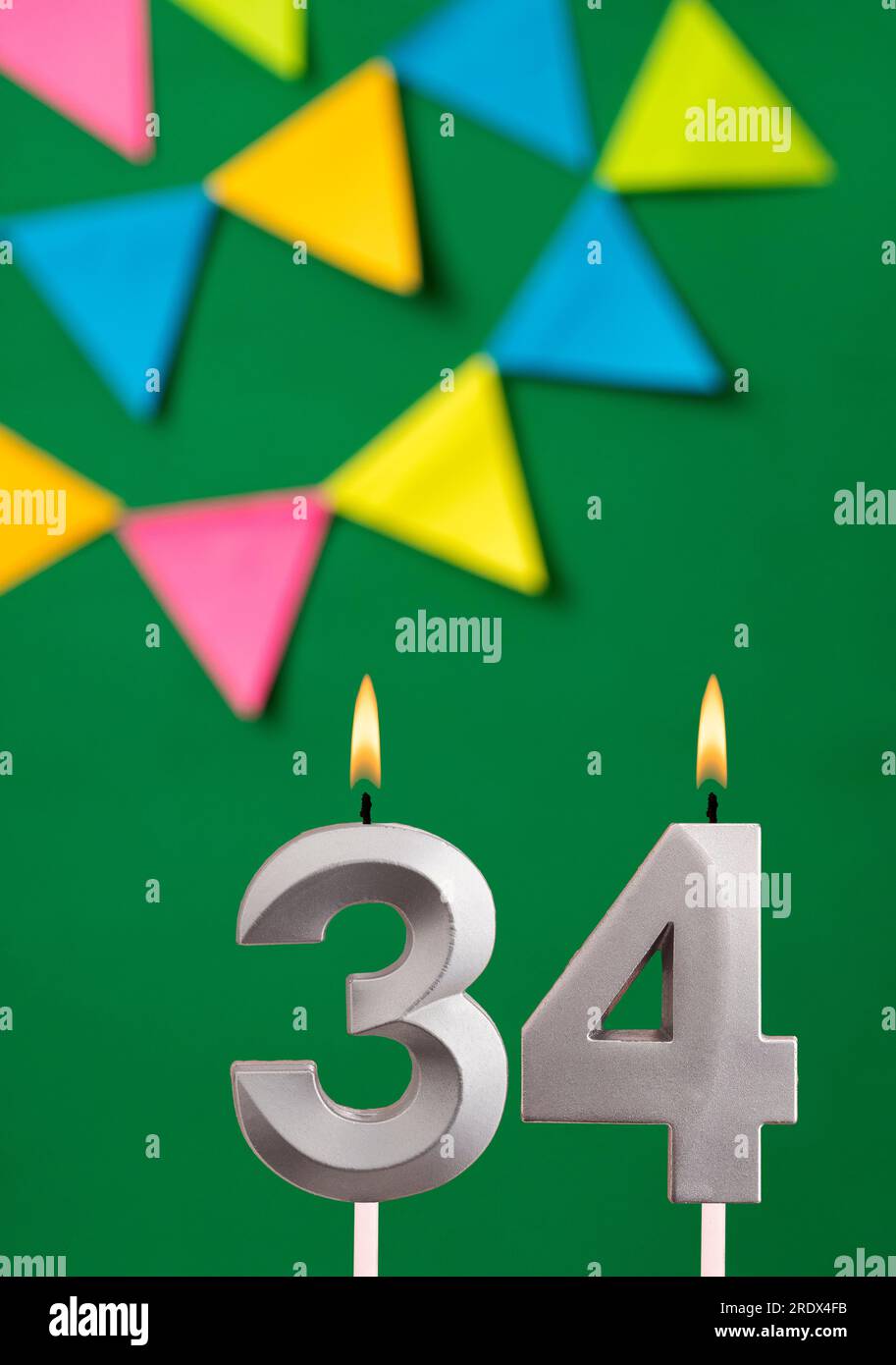 Vertical birthday card with number 34 candle - Green background with ...