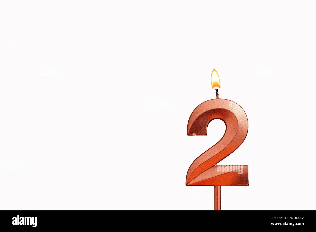 Burning candle number 2 for birthday on white background Stock Photo ...