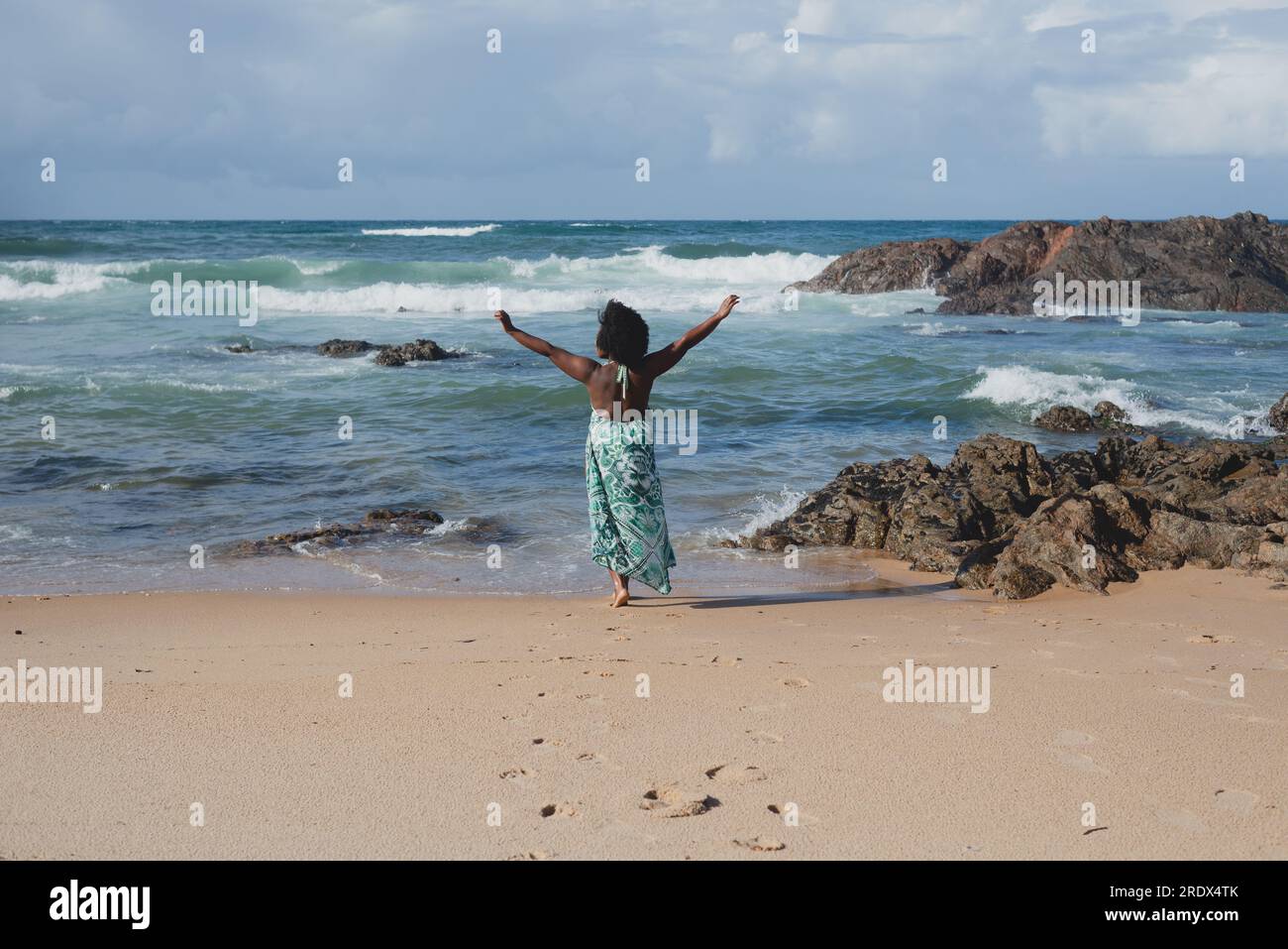 Full length portrait of a beautiful woman with black power hair ...