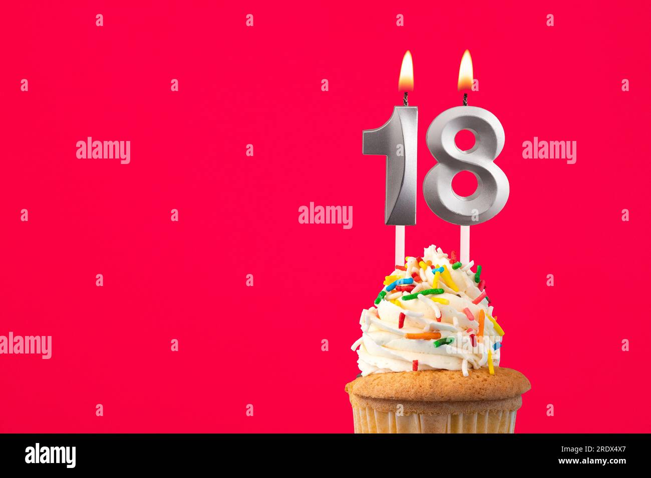 Birthday cake with burning candle number 18 hi-res stock photography ...