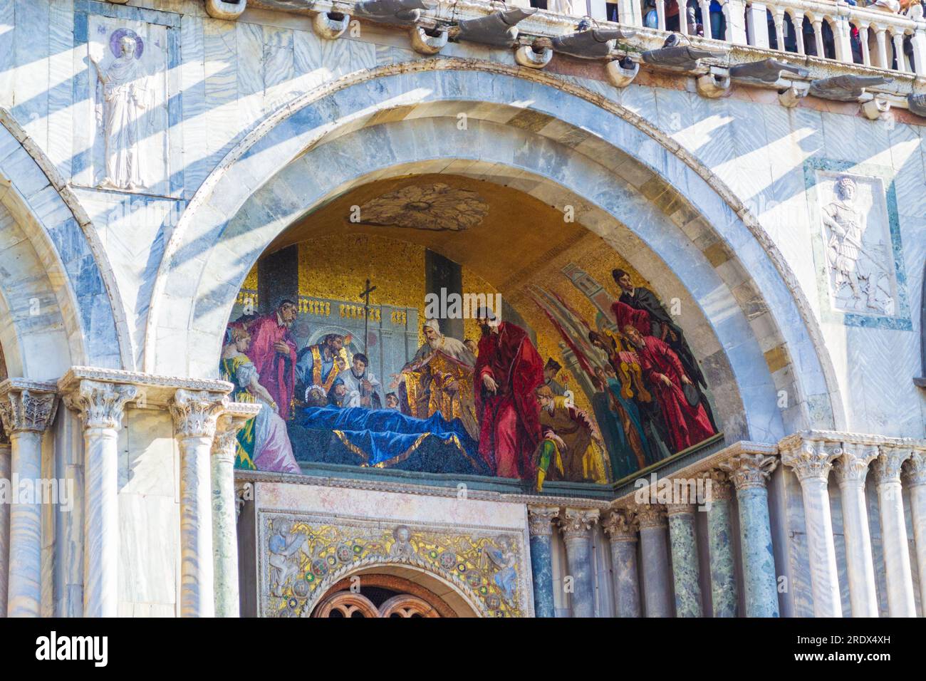 One of the five round-arched portals, enveloped by polychrome marble ...