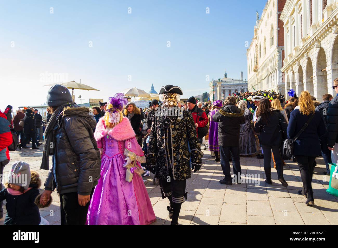 Venice Carnival Celebration at busy waterfront street in front of Doge ...