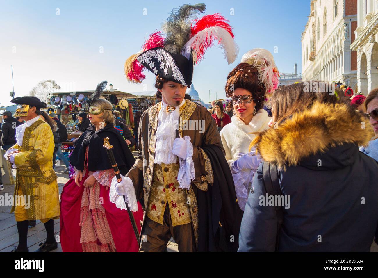 Venice Carnival Celebration at busy waterfront street in front of Doge ...