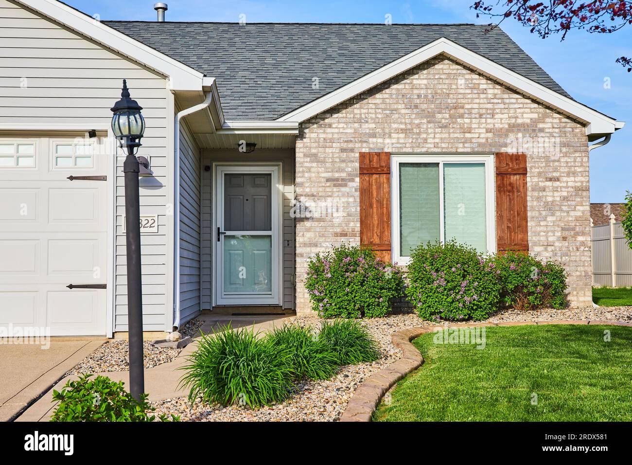Light pole post, tan, gray bricks, slate gray checkered splotched roof ...