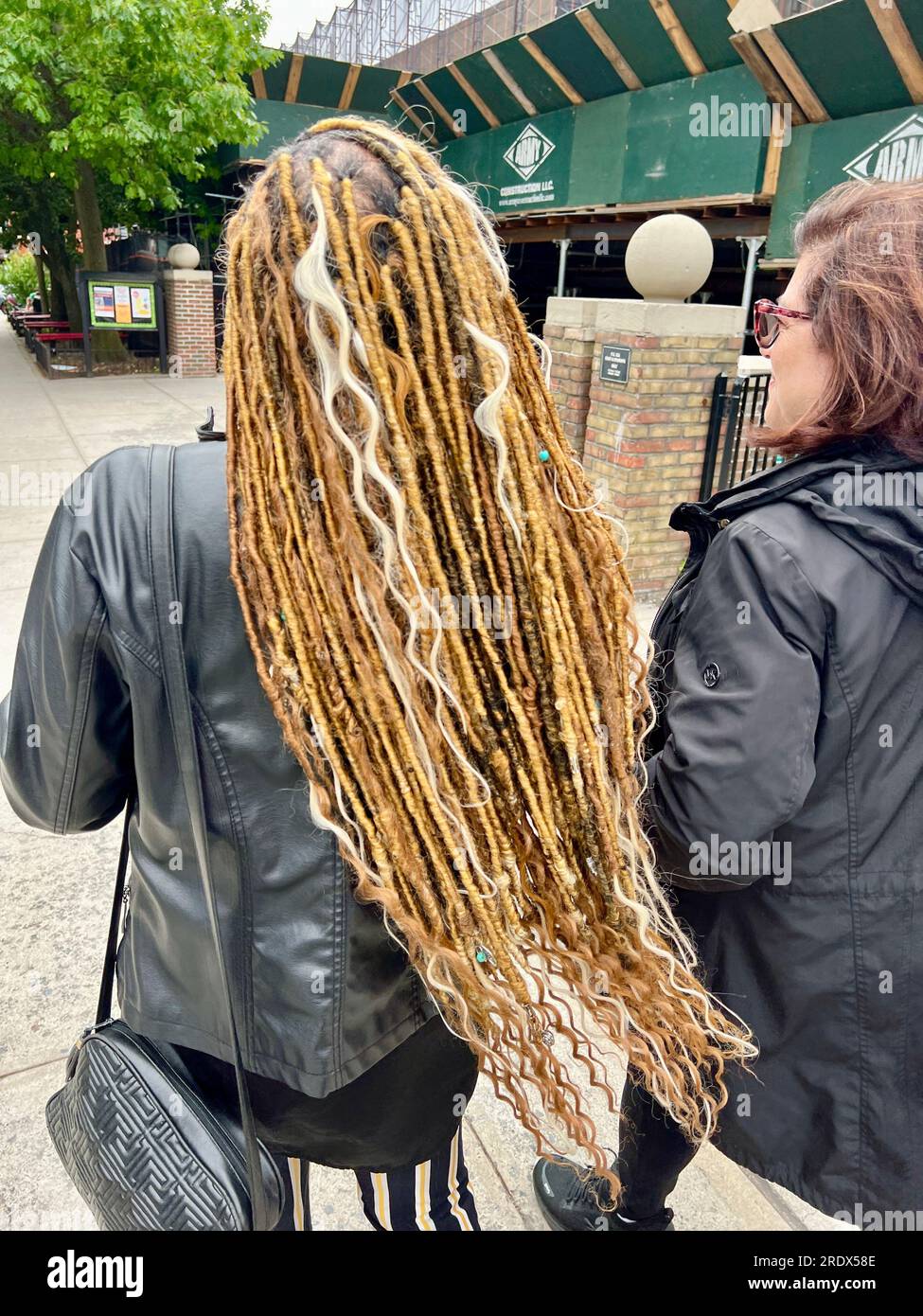 Woman with a head full of dreads on the street in New York City Stock ...