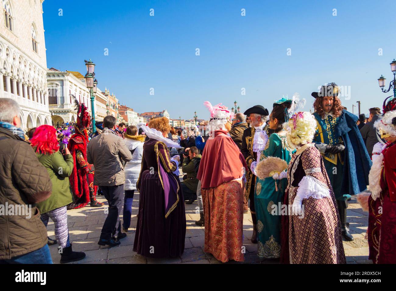 Venice Carnival Celebration at busy waterfront street in front of Doge ...