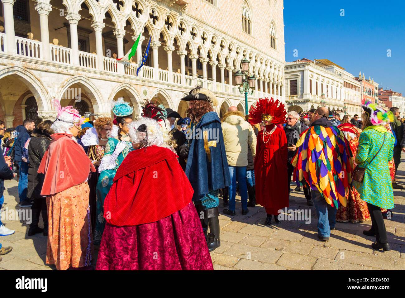 Venice Carnival Celebration at busy waterfront street in front of Doge ...