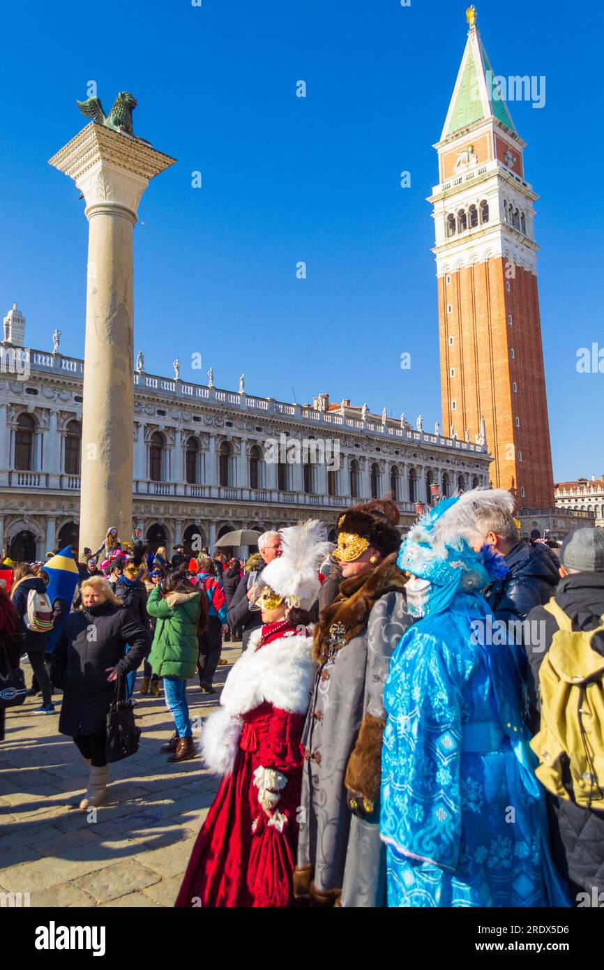 Venice Carnival Celebration at busy waterfront street in front of Doge ...