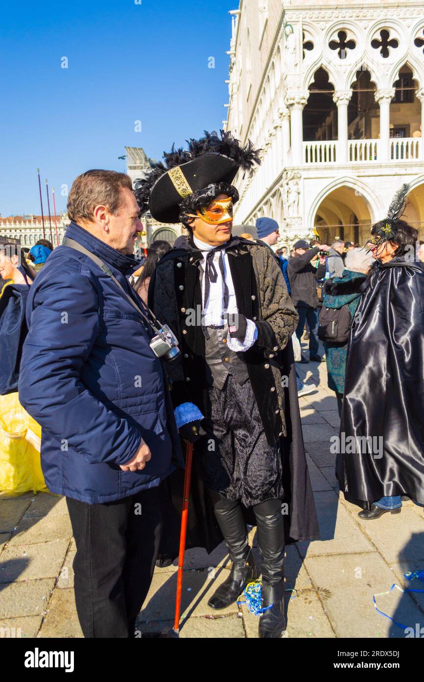 Venice Carnival Celebration at busy waterfront street in front of Doge ...