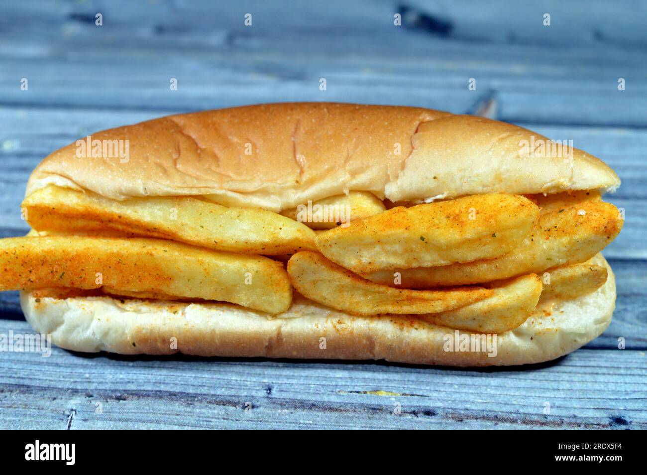 French fries fingers Texas spices sandwich in a long bun, French fries ...