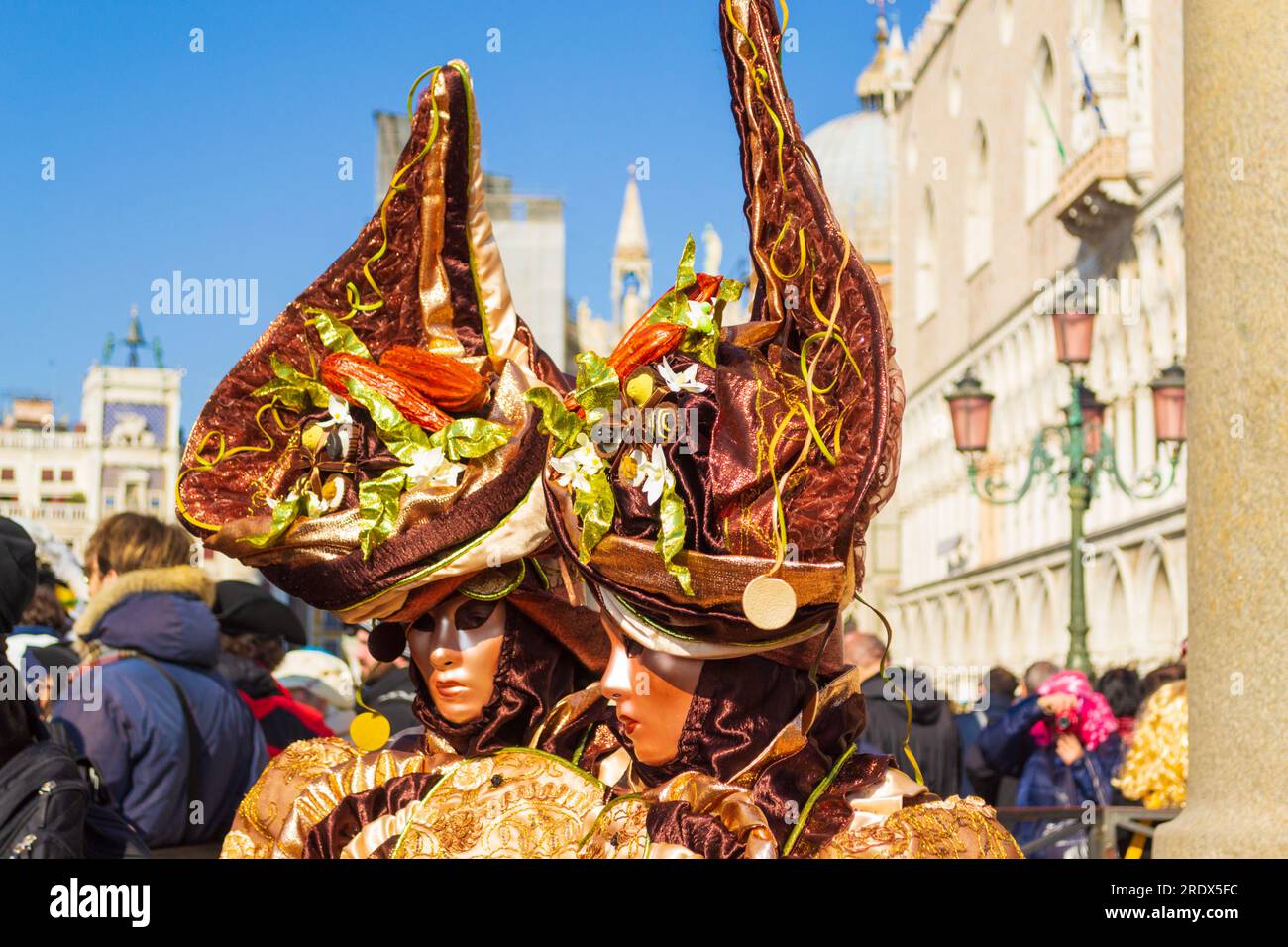 Venice Carnival Celebration at busy waterfront street in front of Doge ...