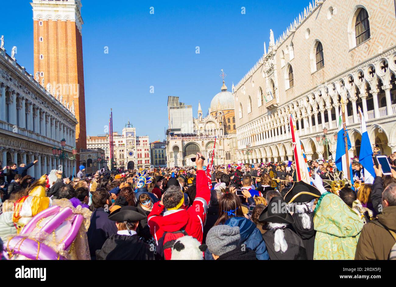 Venice Carnival Celebration at busy waterfront street in front of Doge ...