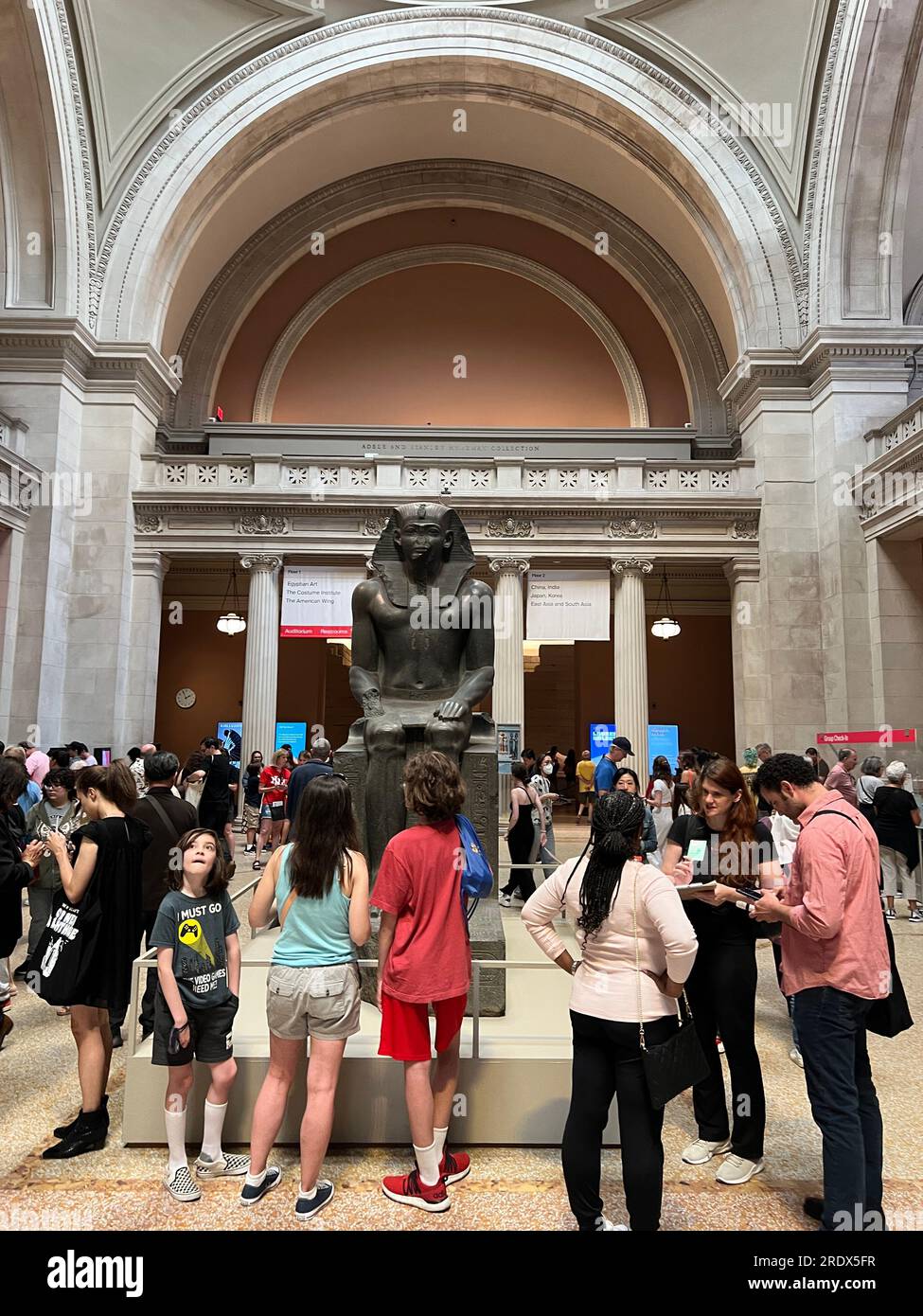 People in the entry Hall at the Metropolitan Museum of Art in New York ...