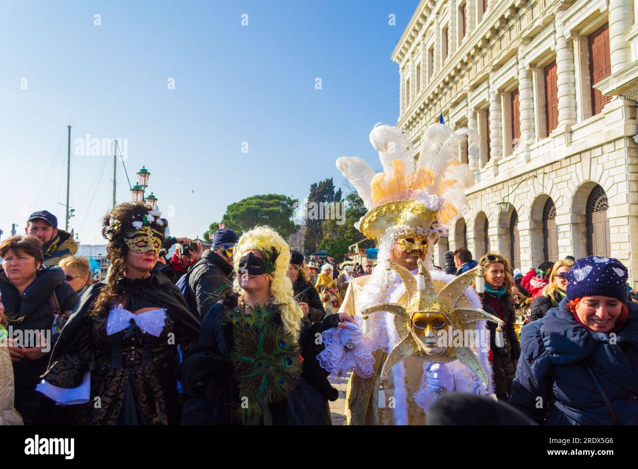 Venice Carnival Celebration at busy waterfront street in front of Doge ...