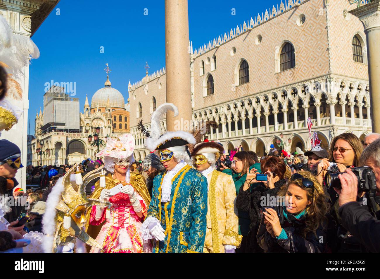 Venice Carnival Celebration at busy waterfront street in front of Doge ...