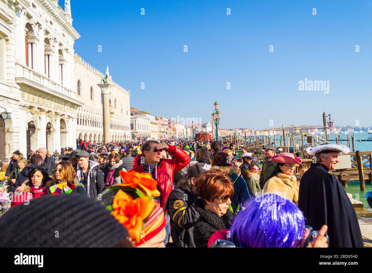 Venice Carnival Celebration at busy waterfront street in front of Doge ...