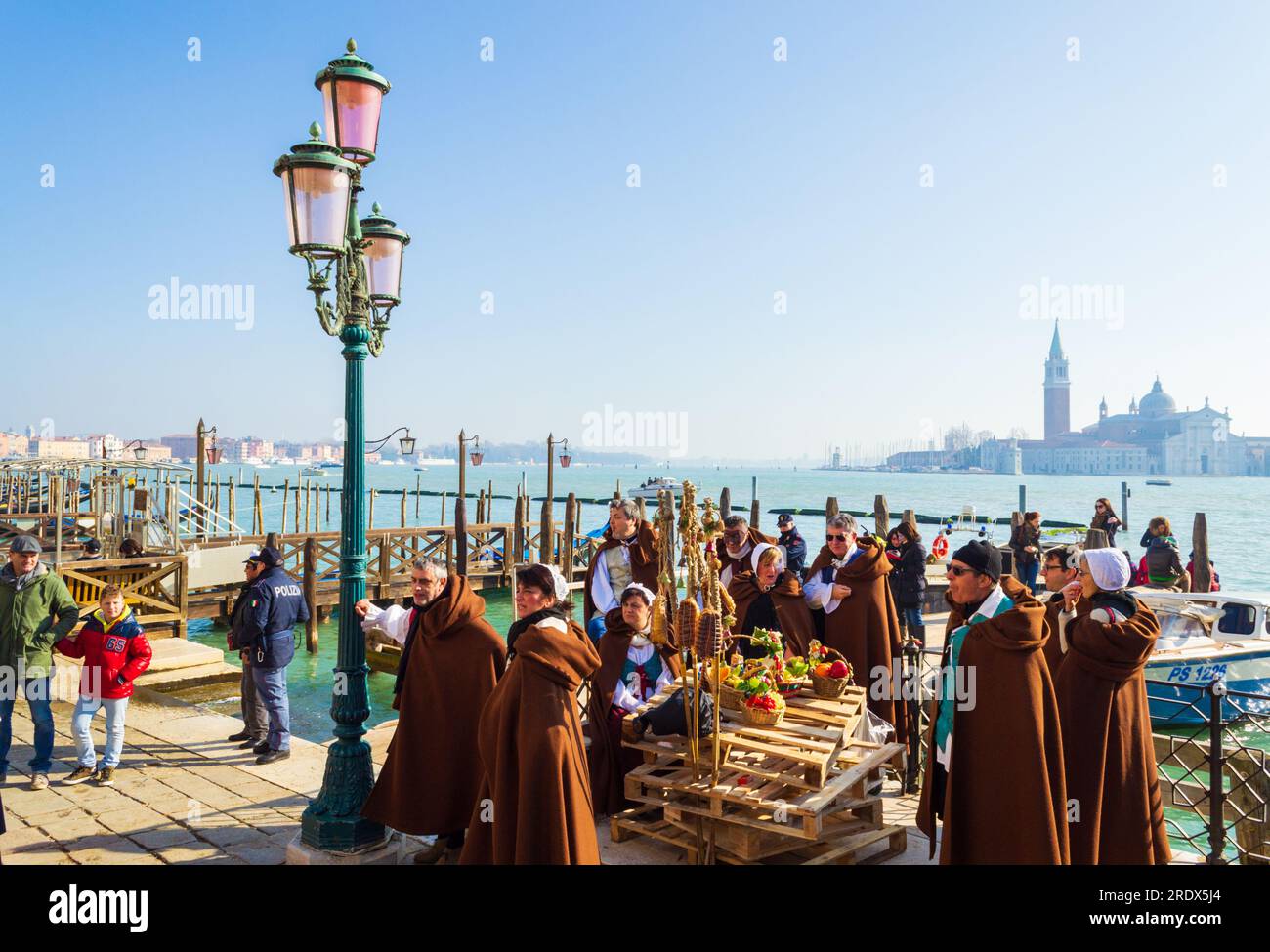 Venice Carnival Celebration at busy waterfront street in front of Doge ...